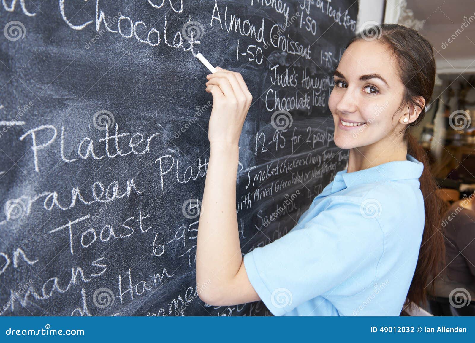Waitress in Restaurant Writing Menu on Blackboard Stock Photo - Image ...