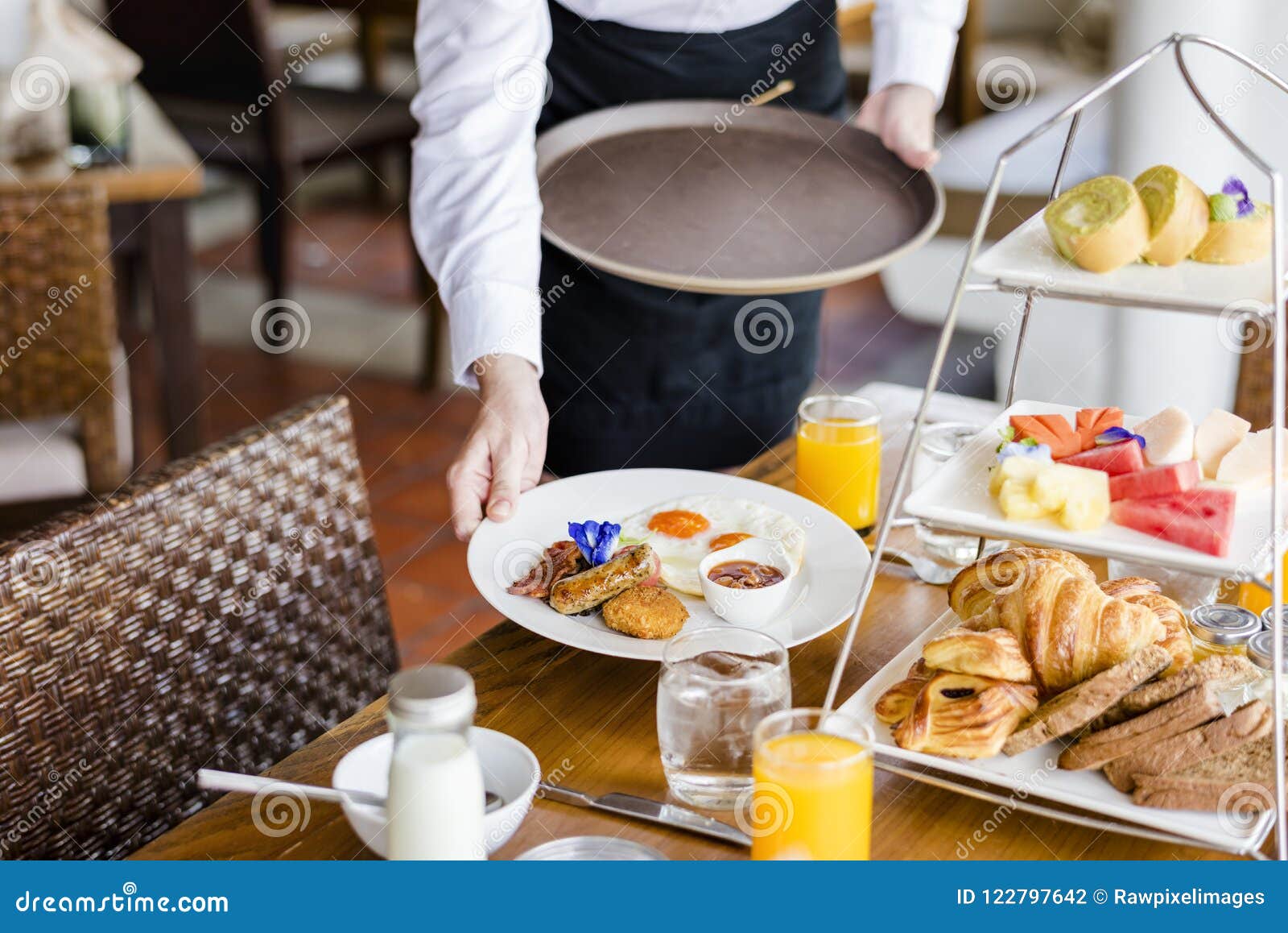 Waitress Serving Breakfast at a Restaurant Stock Photo - Image of ...
