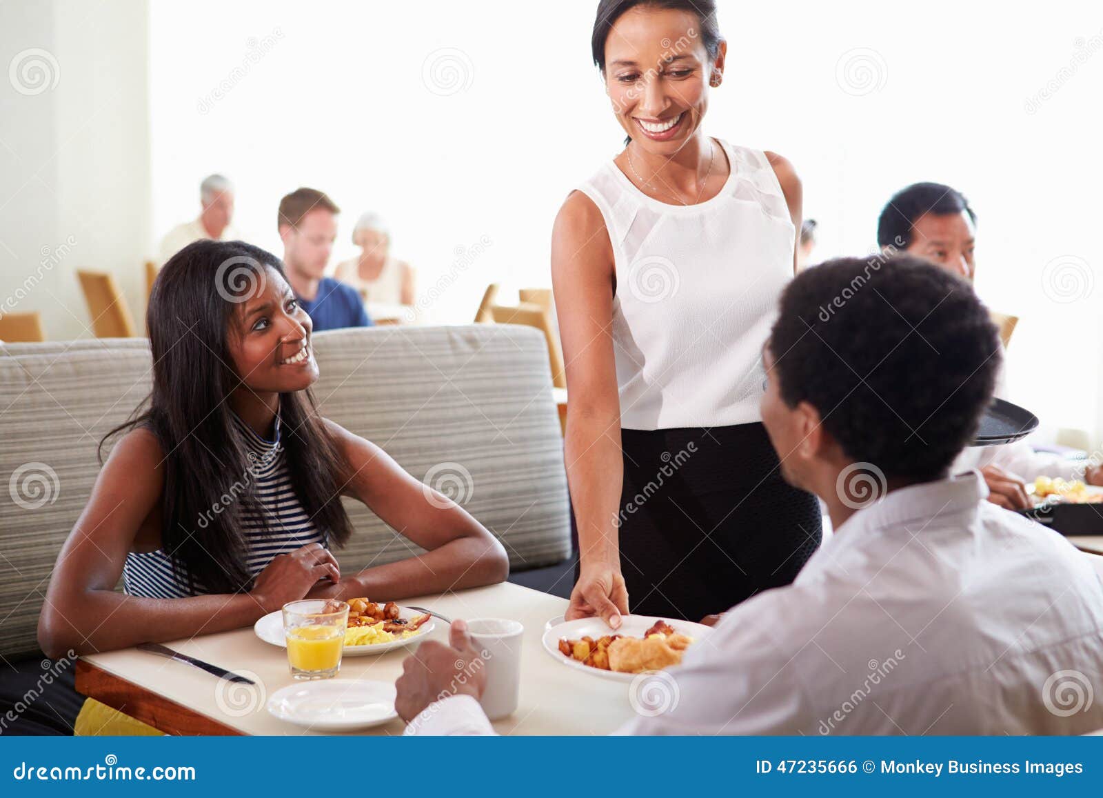 Waitress Serving Couple Breakfast in Hotel Restaurant Stock Photo ...