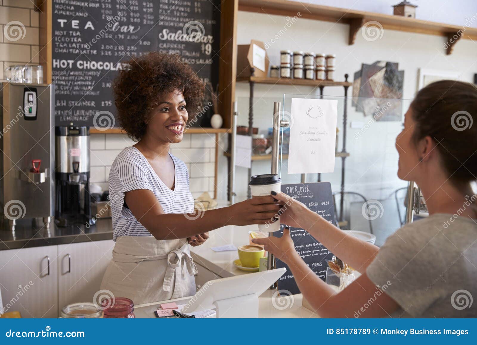 Waitress Serving Customer Over the Counter at a Coffee Shop Stock Image ...