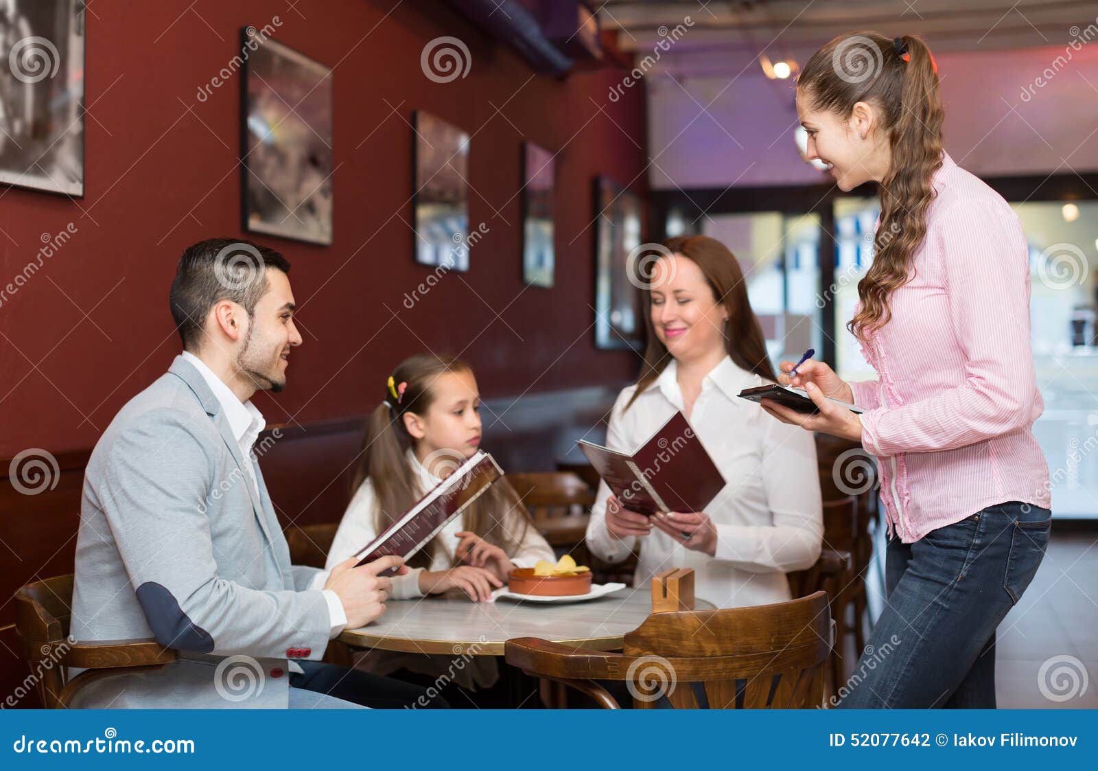 Waitress Serving Family of Three Stock Photo - Image of ordering ...
