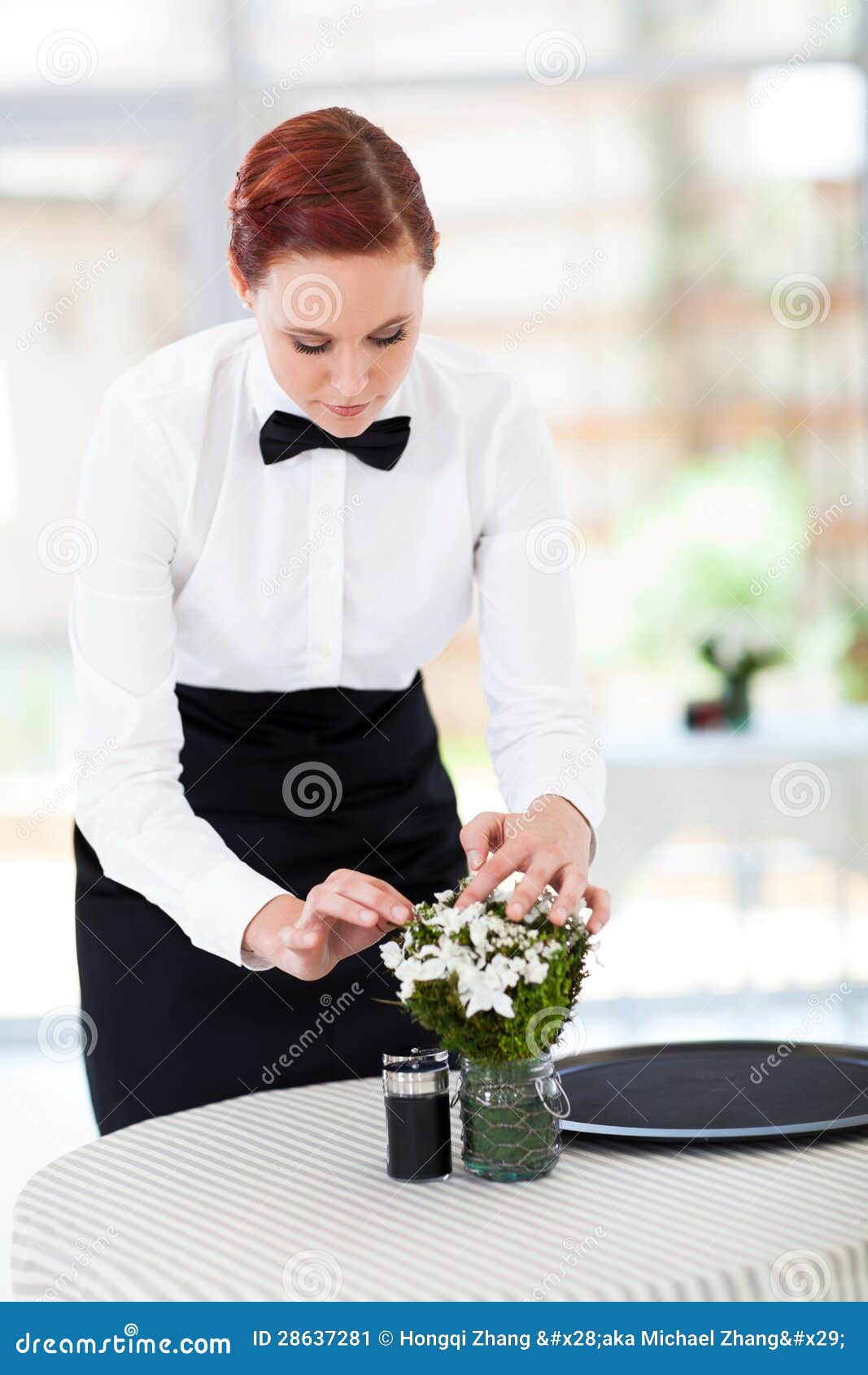Waitress setting table stock image. Image of modern, looking - 28637281