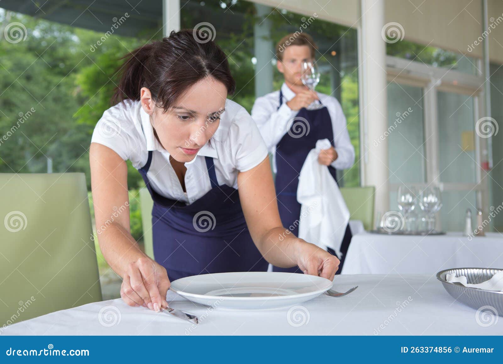 Waitress Setting Table in Restaurant Stock Photo - Image of uniform ...