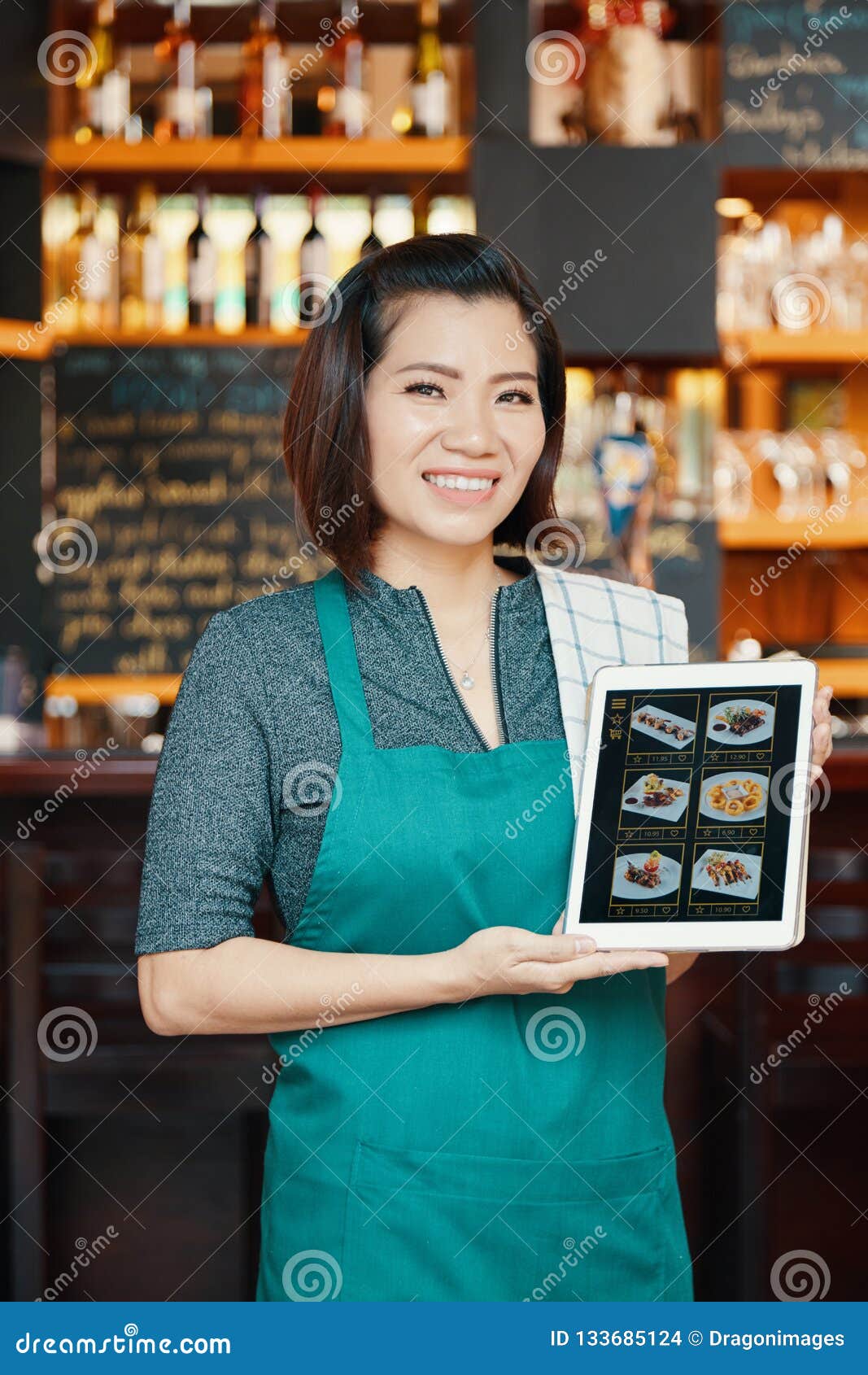 Waitress showing meny stock photo. Image of standing - 133685124