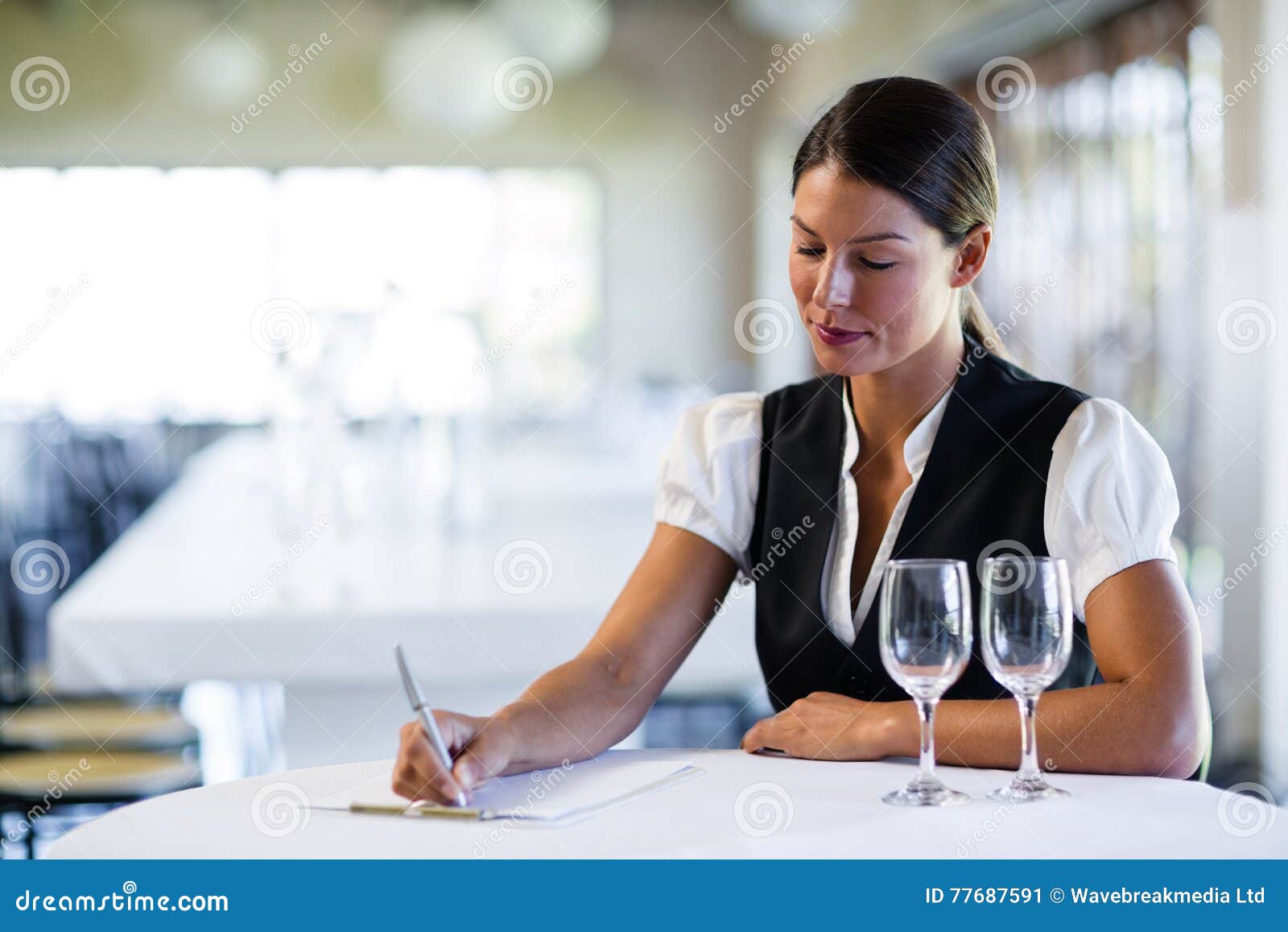 Waitress Sitting at the Table and Writing Notes Stock Image - Image of ...