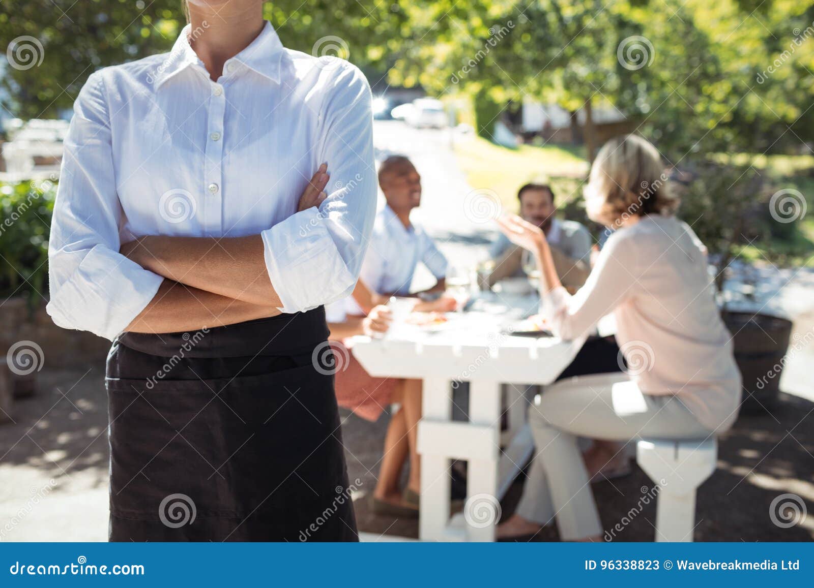 Waitress Standing with Arms Crossed in Restaurant Stock Image - Image ...