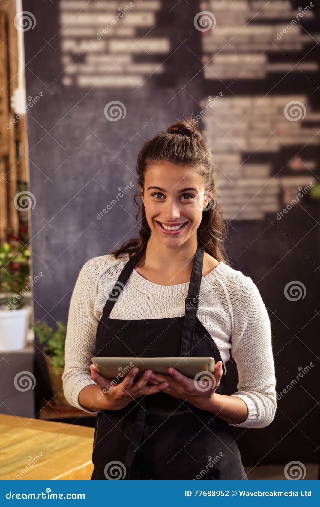 Waitress Standing with Digital Tablet in Cafeteria Stock Photo - Image ...