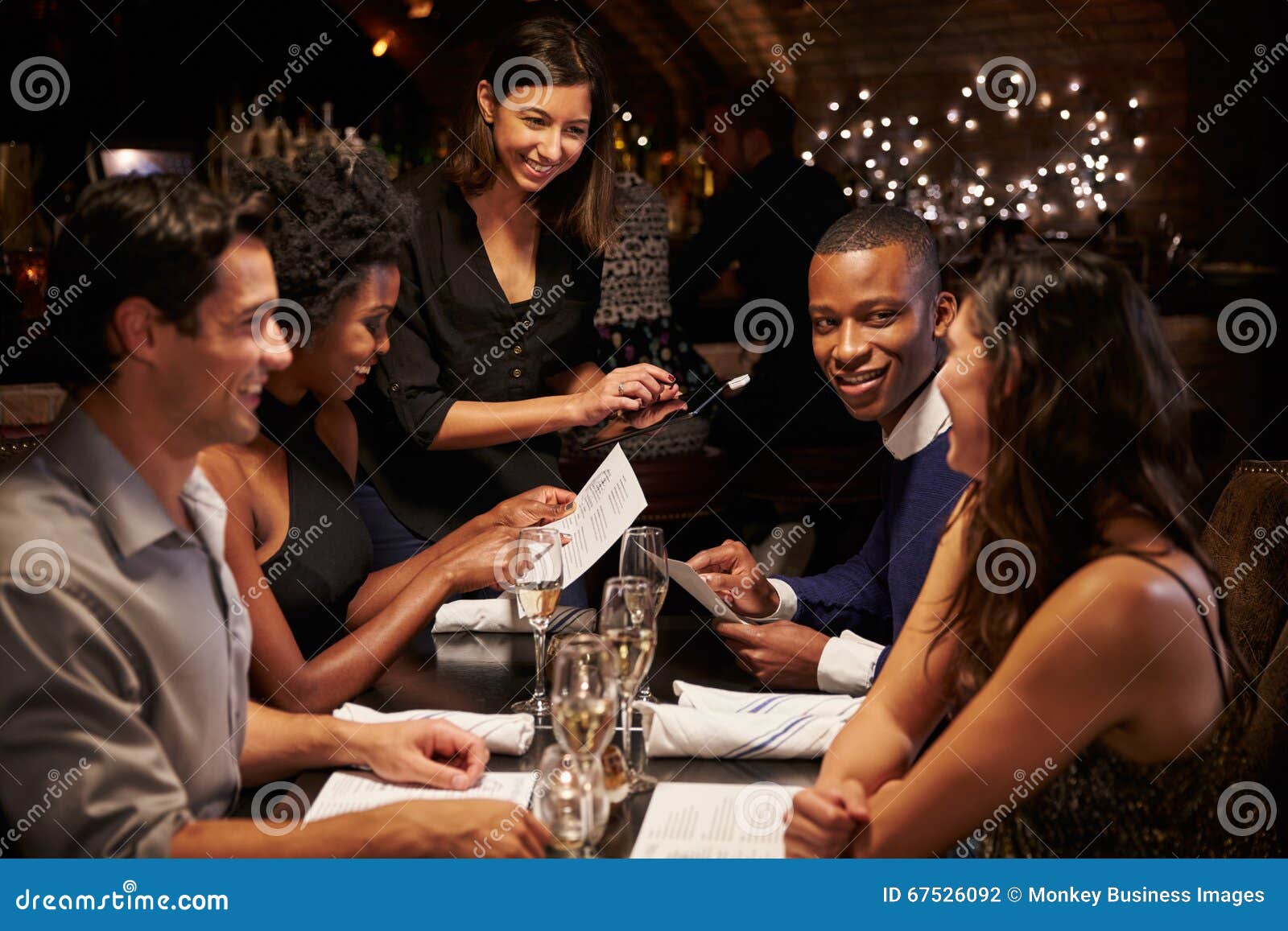 Waitress Takes Order in Restaurant Using Digital Tablet Stock Photo ...