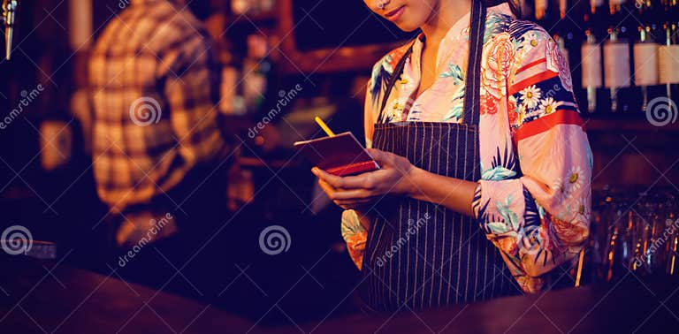 Waitress Taking an Order on Notepad at Counter Stock Image - Image of ...