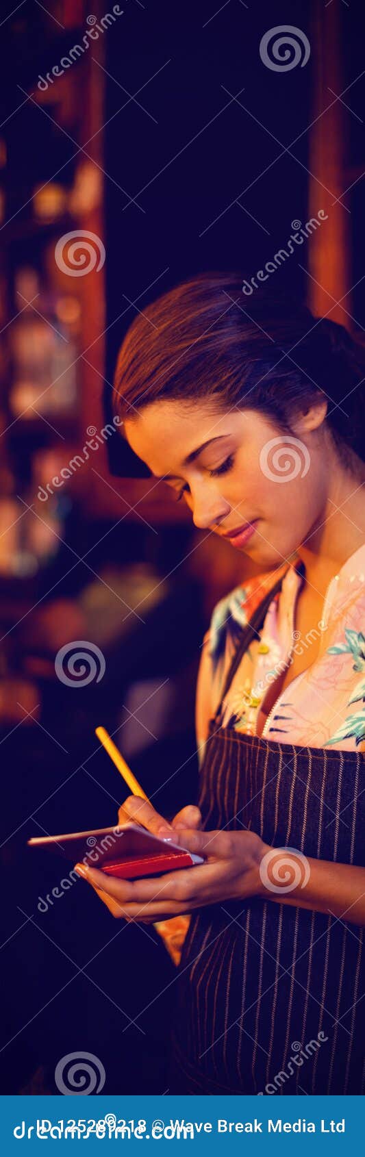 Waitress Taking an Order on Notepad at Counter Stock Photo - Image of ...