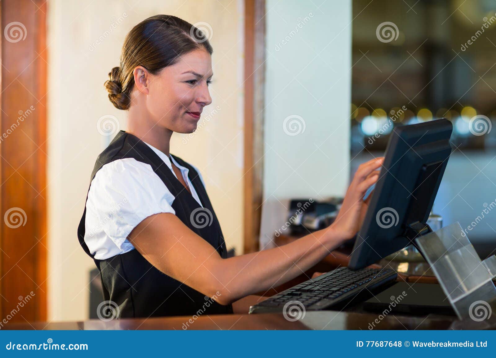 Waitress Using a Computer at Counter Stock Photo - Image of indoors ...