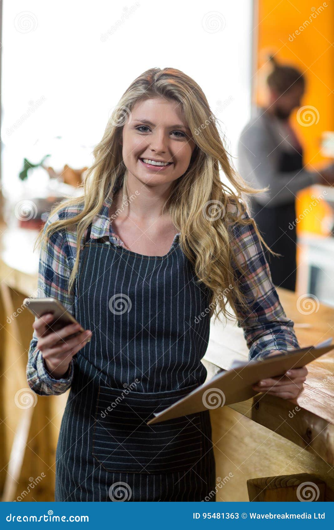 Waitress Using Mobile Phone at Counter in CafÃ© Stock Image - Image of ...