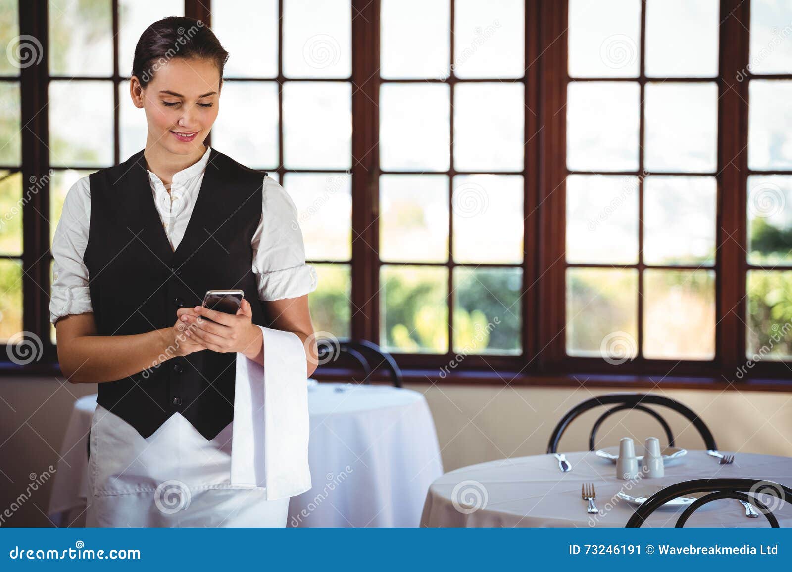 Waitress Using Mobile Phone Stock Image - Image of professional ...