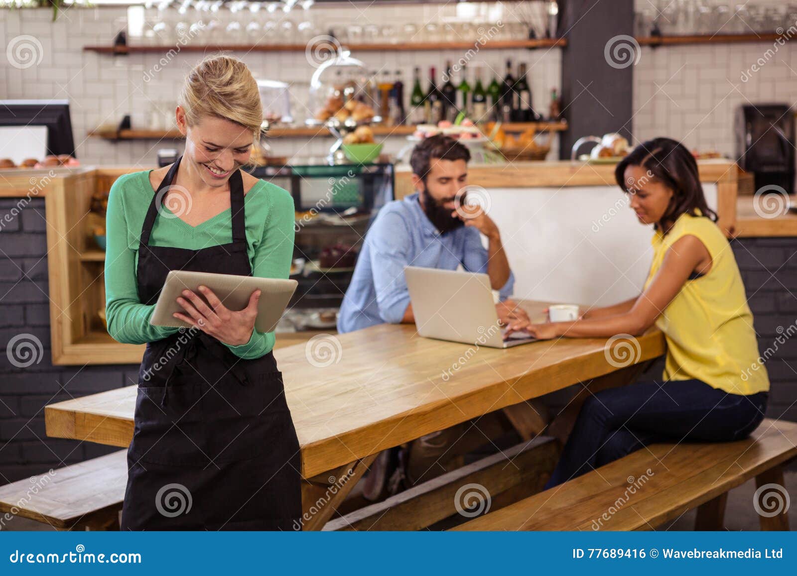Waitress using a tablet stock photo. Image of lifestyle - 77689416