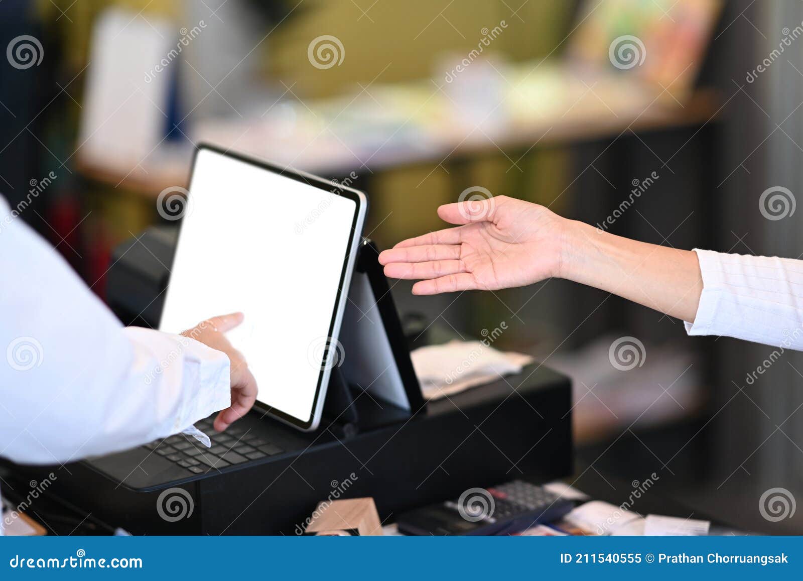Waitress Using Tablet To Receive Orders from Customers at Counter ...