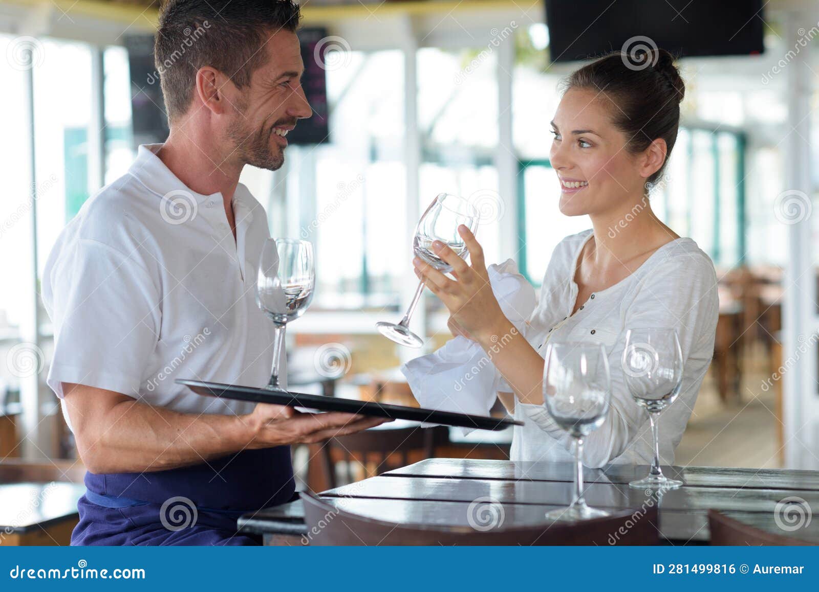 Waitress and Waiter Cleaning Glasses in Restaurant Stock Photo - Image ...