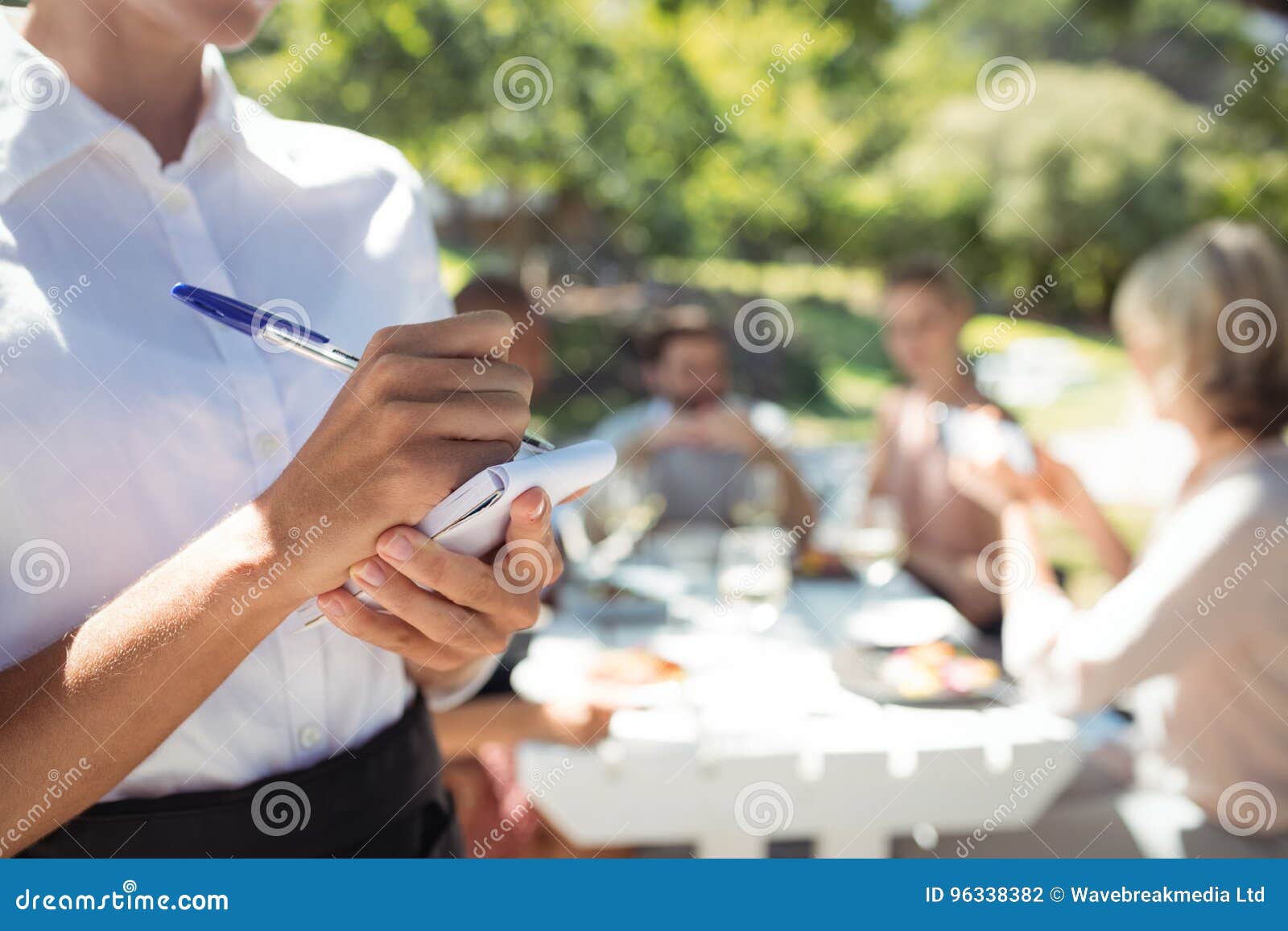 Waitress Writing Order on Notepad Stock Photo - Image of hotel, staff ...