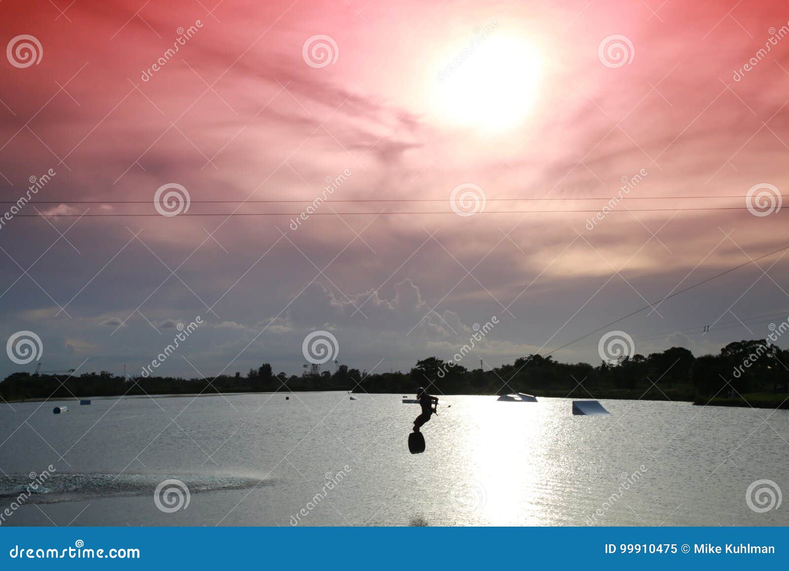 Wake Boarder Near Sunset editorial image. Image of clouds - 99910475