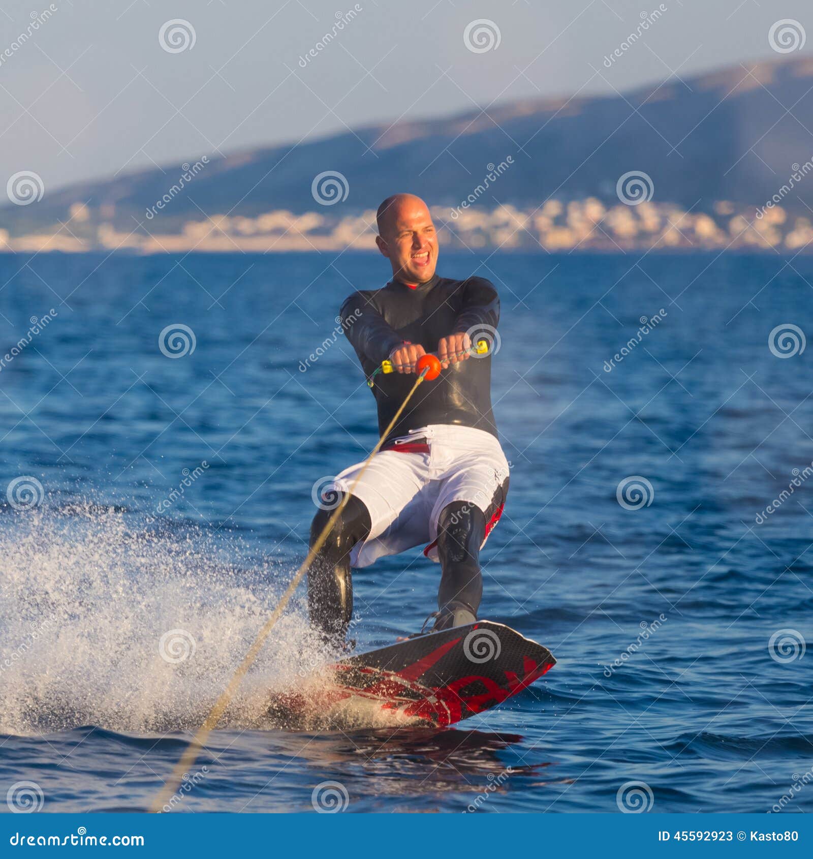 Wakeboarder in sunset. stock image. Image of sunset, swimsuit - 45592923