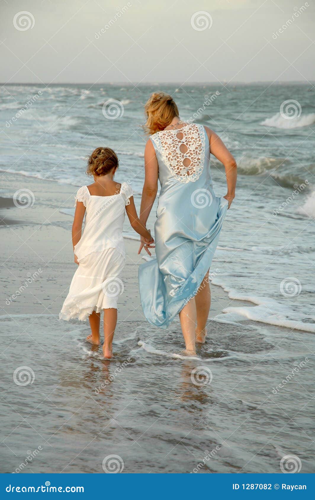 Walk along the shore stock photo. Image of blue, attire - 1287082