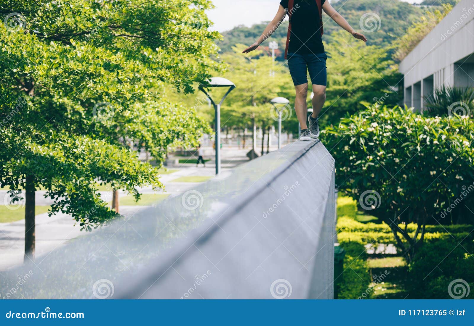 Walking on the Edge of a Urban Building Wall at City Stock Image ...