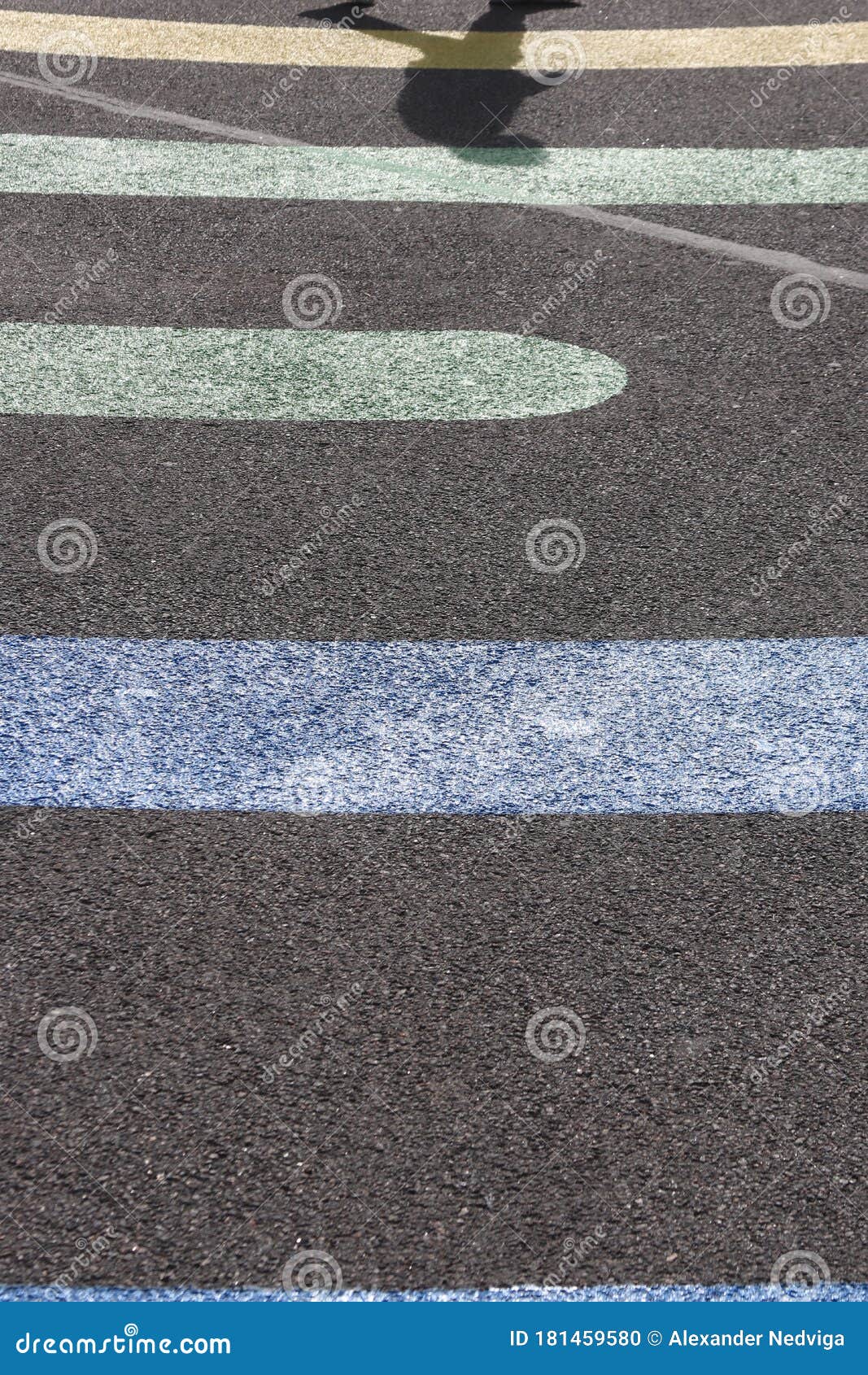 Walking Man Shadow on Colored Line Shapes on Asphalt Stock Photo ...