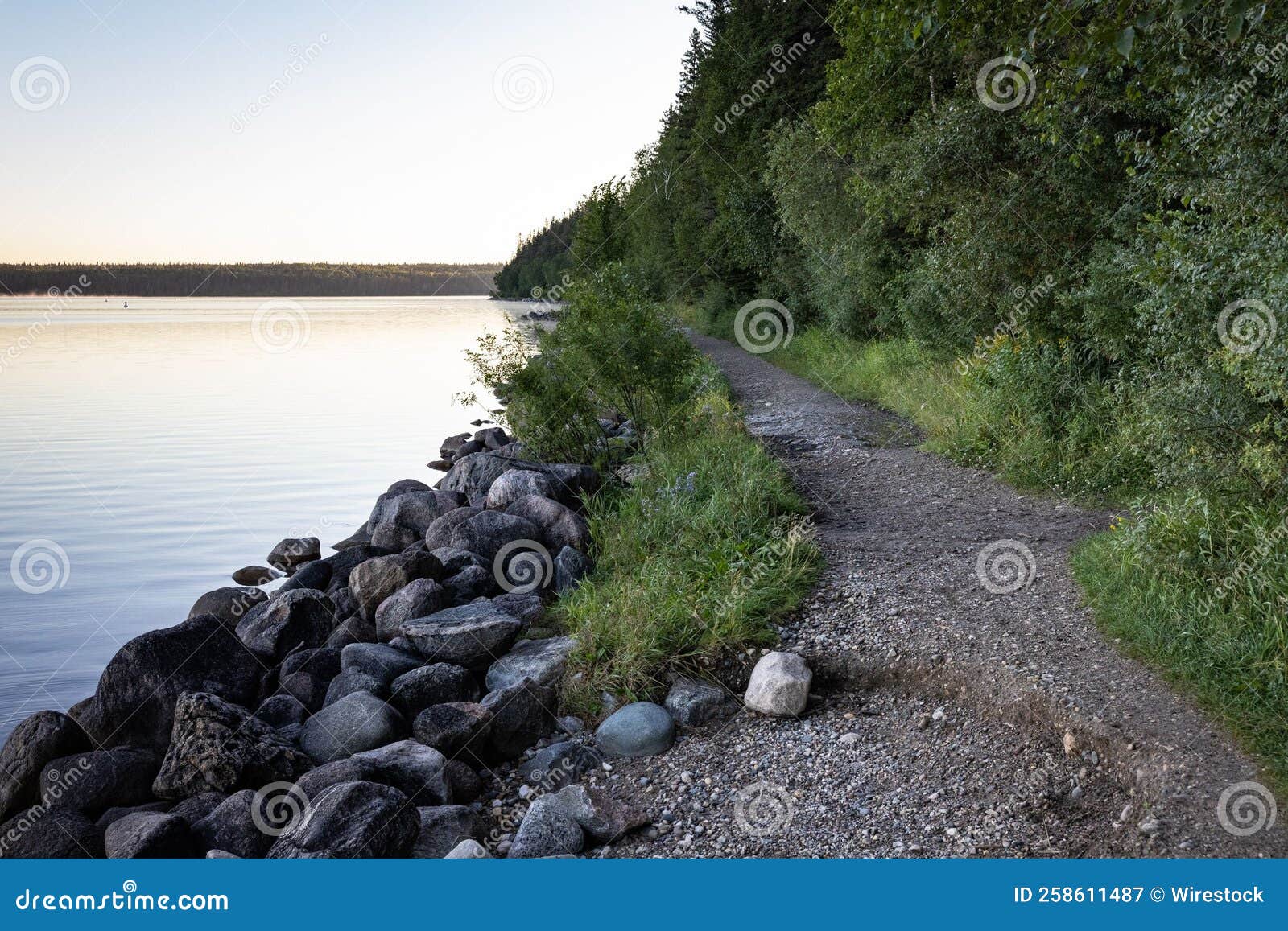 Walking path near a lake stock image. Image of path - 258611487