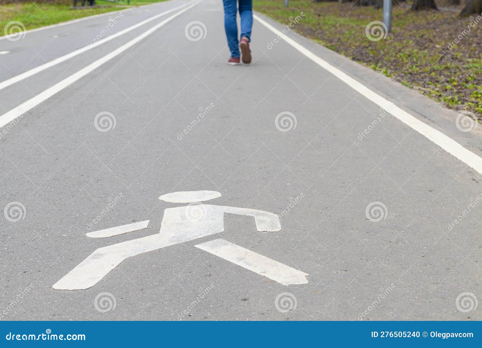 Walking Path in the Park with a Sign on the Pavement Stock Photo ...