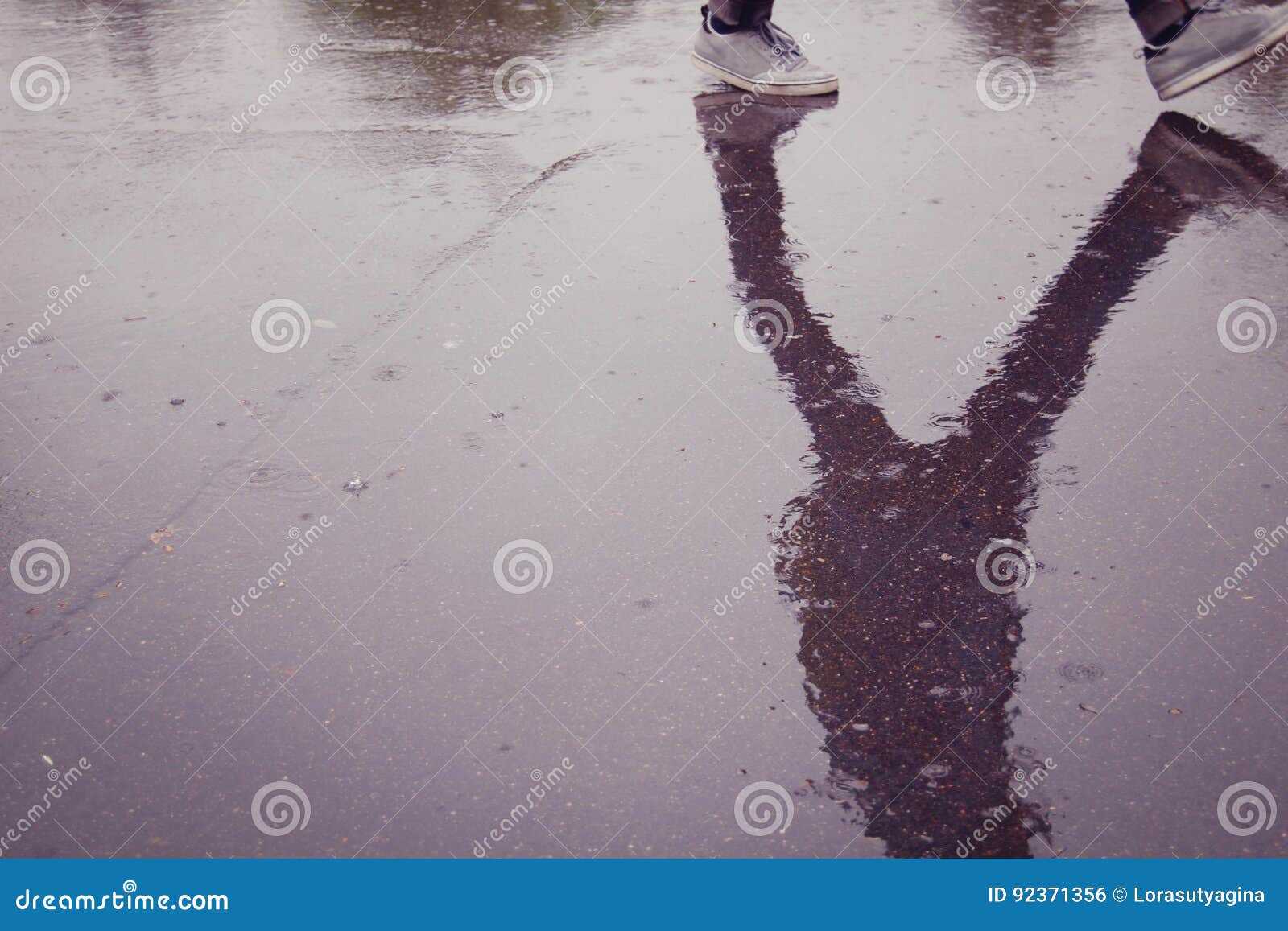 Walking Student. Reflection in the Wet Surface Stock Photo - Image of ...