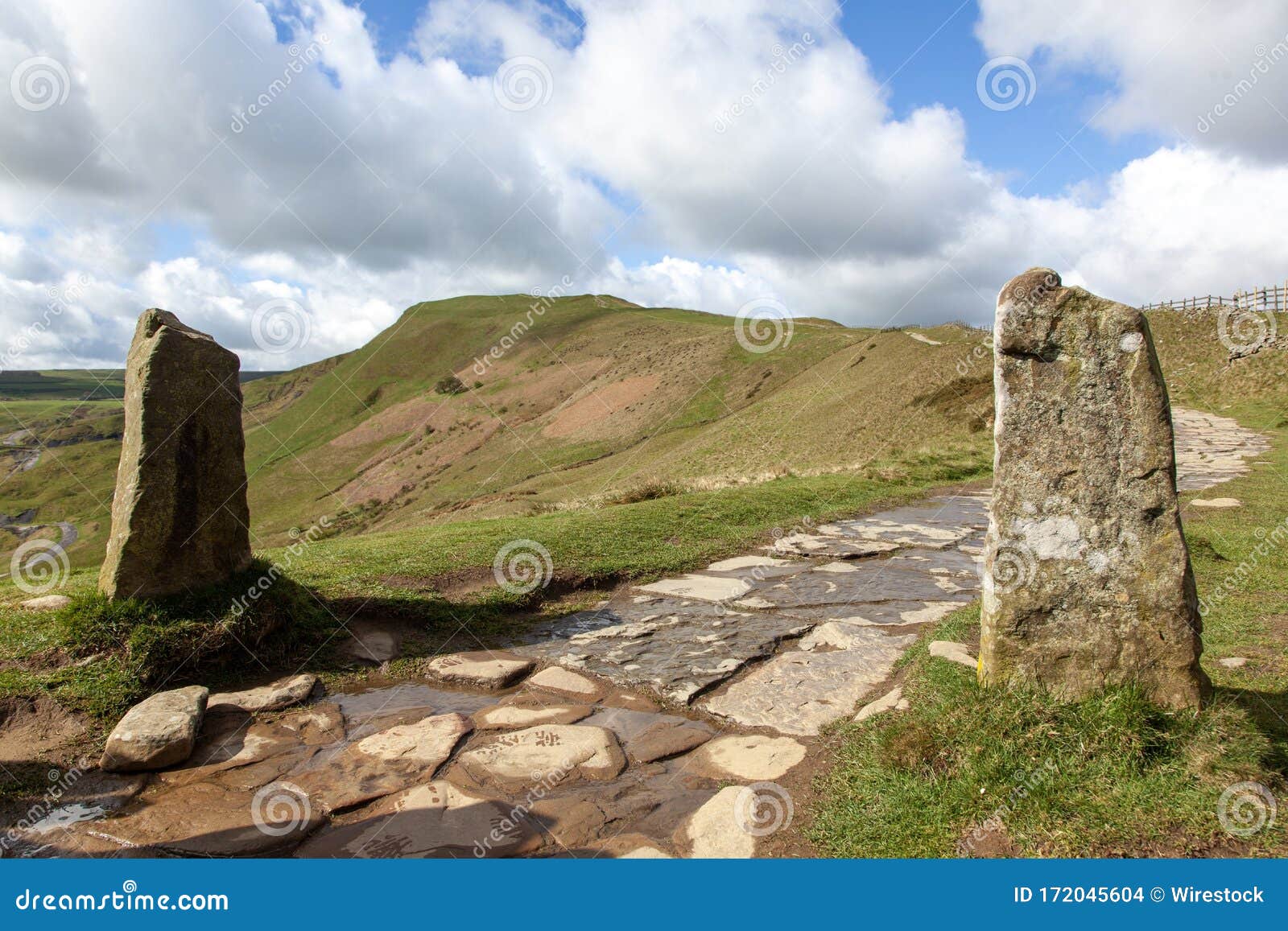 Walking Trail on the Hill Covered in Greenery and Outcrops Under a ...