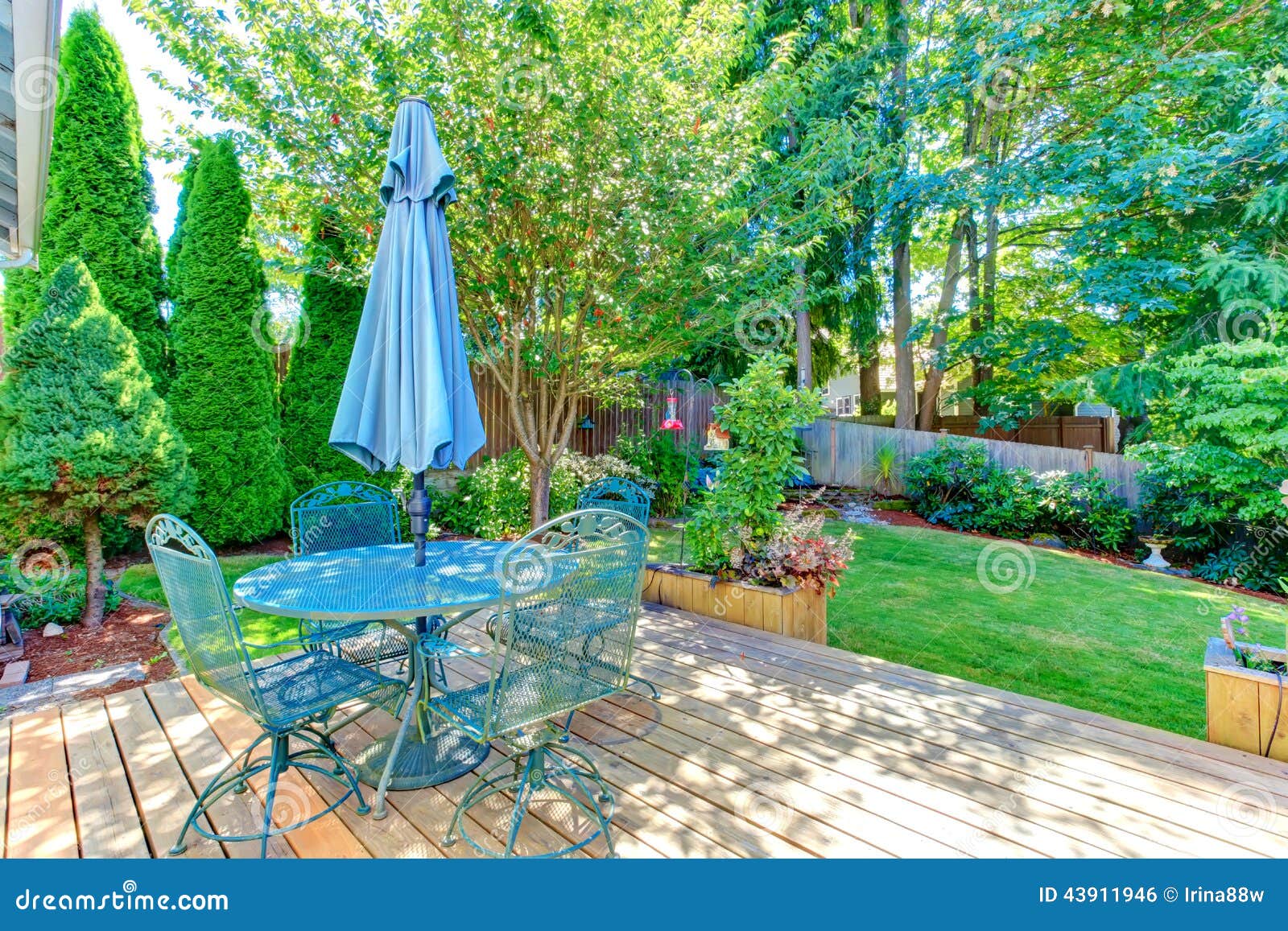 Walkout Deck with Patio Table and Umbrella Stock Photo - Image of ...