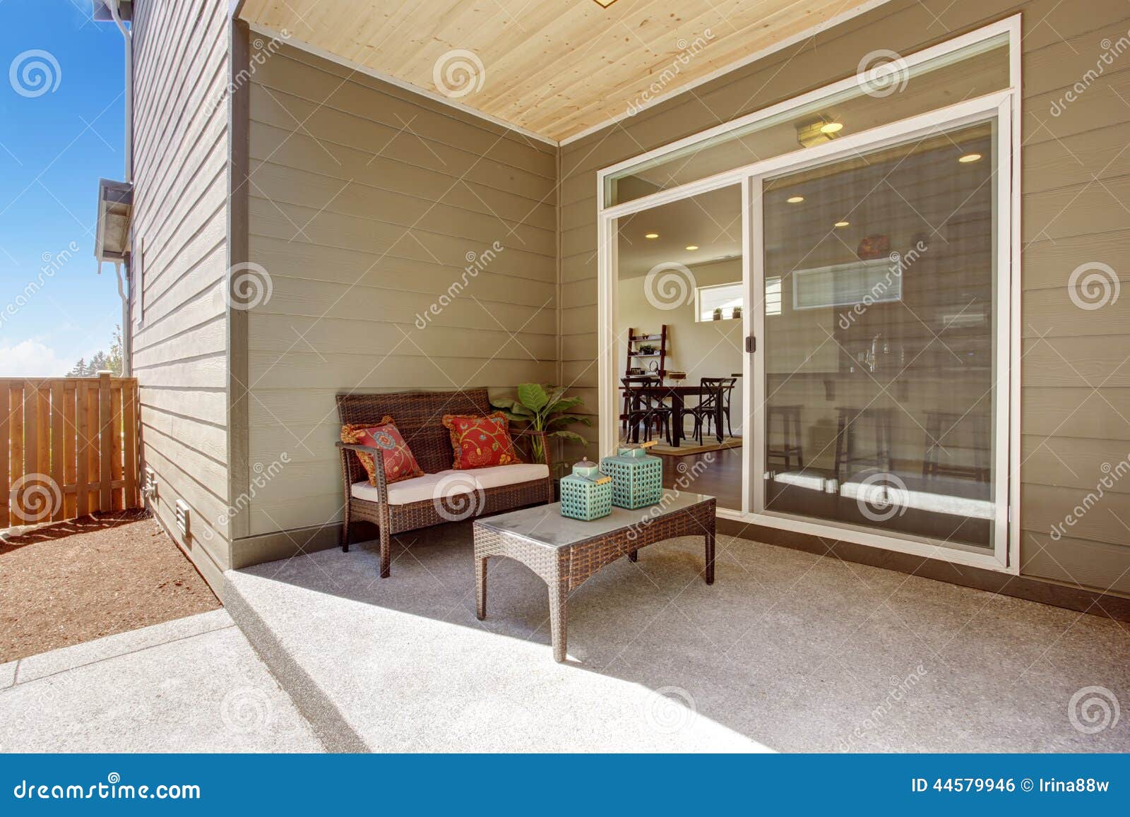 Walkout Deck with Wicker Bench and Table Stock Photo - Image of outside ...