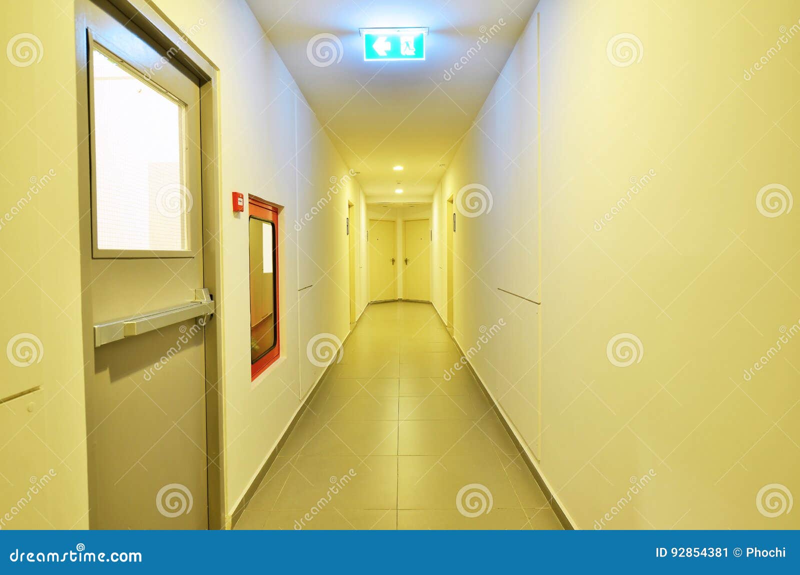 Walkway To The Fire Escape Door, Fire Exit Sign Over Corridor Walkway ...