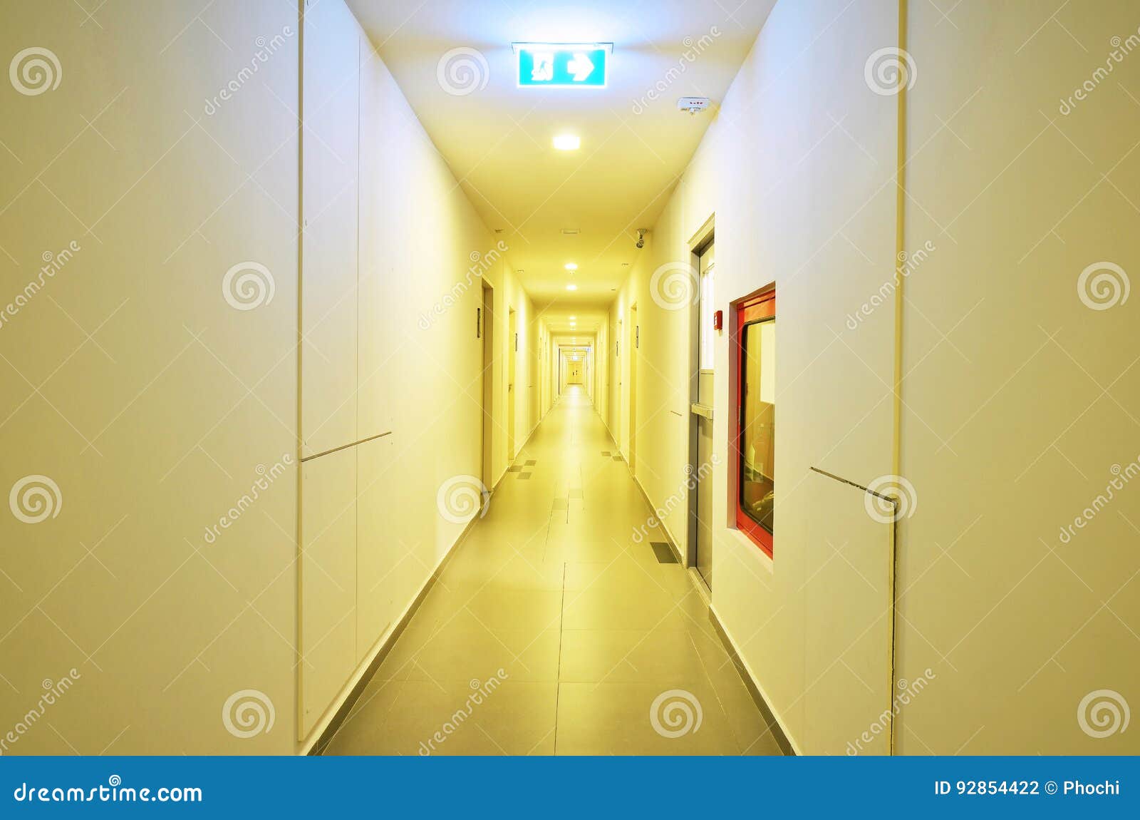 Walkway To The Fire Escape Door, Fire Exit Sign Over Corridor Walkway ...