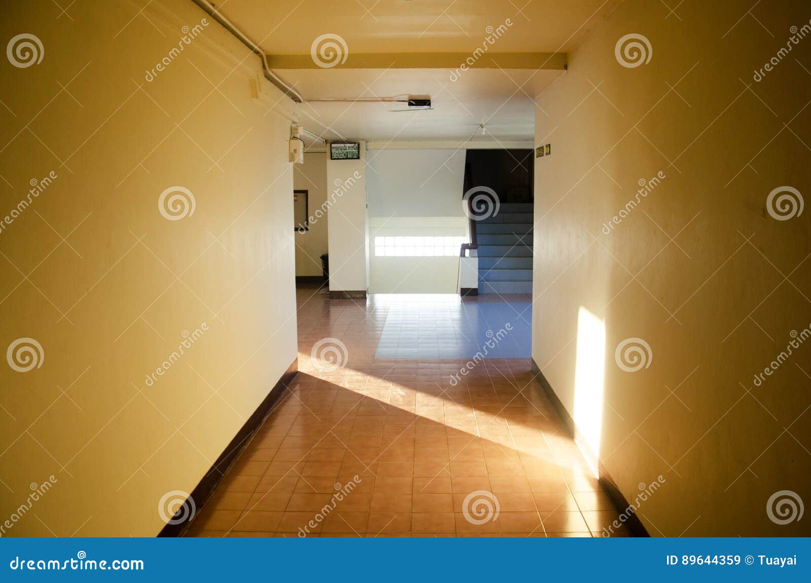 Walkway To The Fire Escape Door, Fire Exit Sign Over Corridor Walkway ...