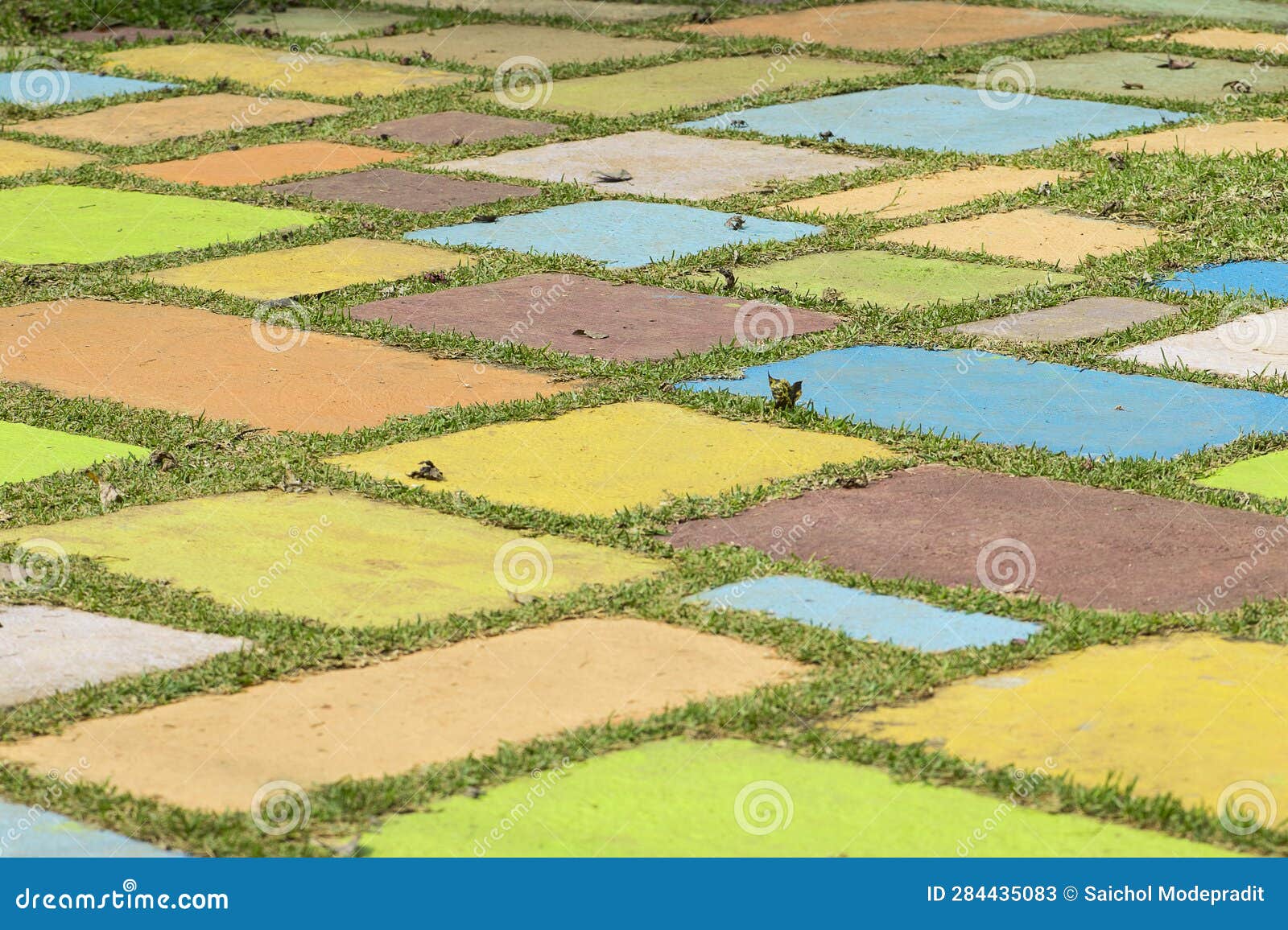 Walkway with Grass Growing between the Colorful Paving Stock Image ...