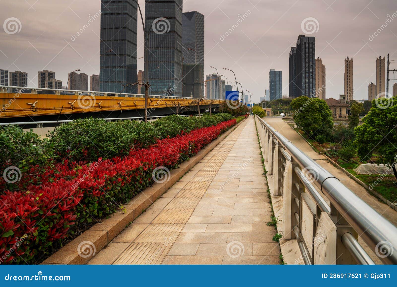 Walkway in the modern city stock image. Image of park - 286917621