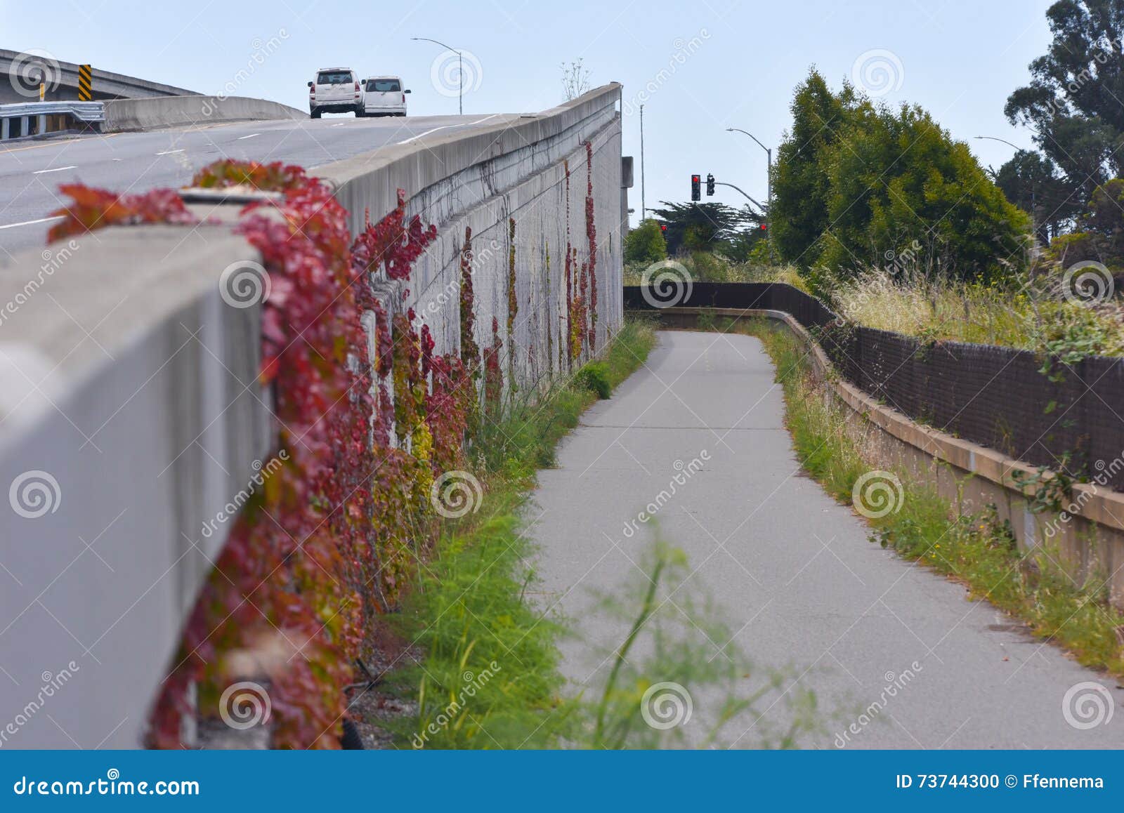 Walkway Next To a Freeway with Fence Stock Photo - Image of sidewalk ...