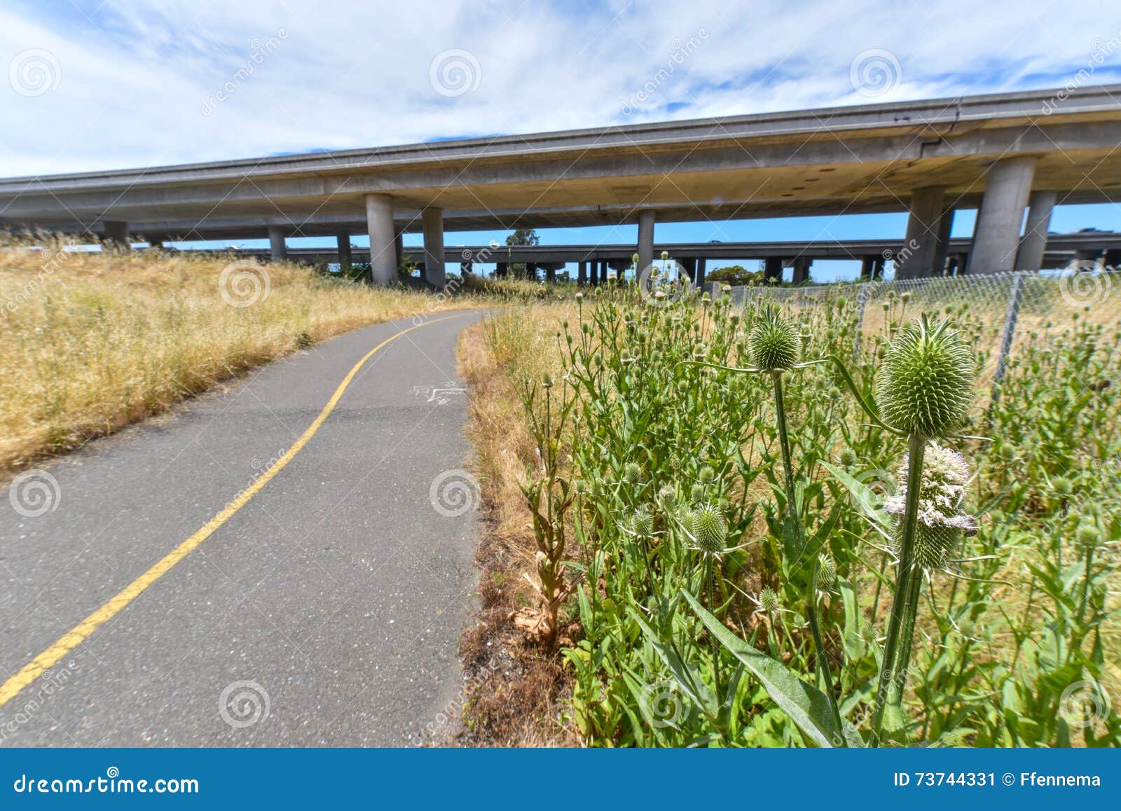 Walkway Next To a Freeway with Fence Stock Image - Image of walkway ...