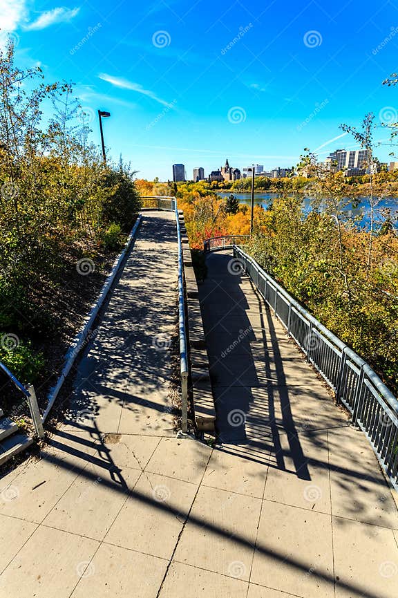 A Walkway with a Railing and a Bench Stock Image - Image of foliage ...