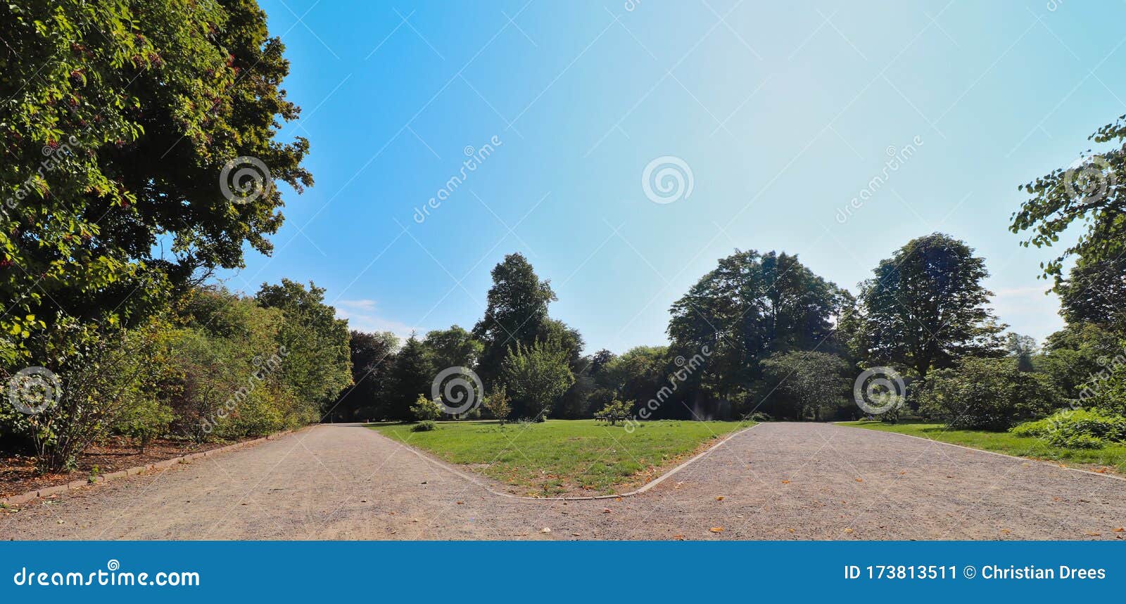 Walkway Splitting into Two Ways in a Park with Blue Sky Stock Image ...