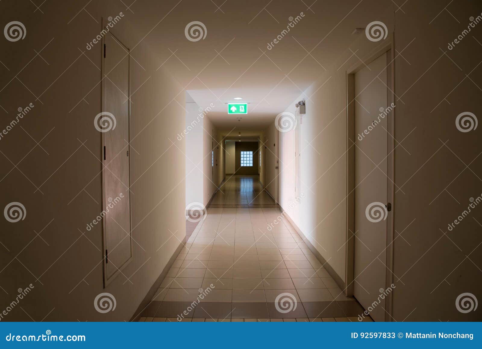 Walkway To The Fire Escape Door, Fire Exit Sign Over Corridor Walkway ...