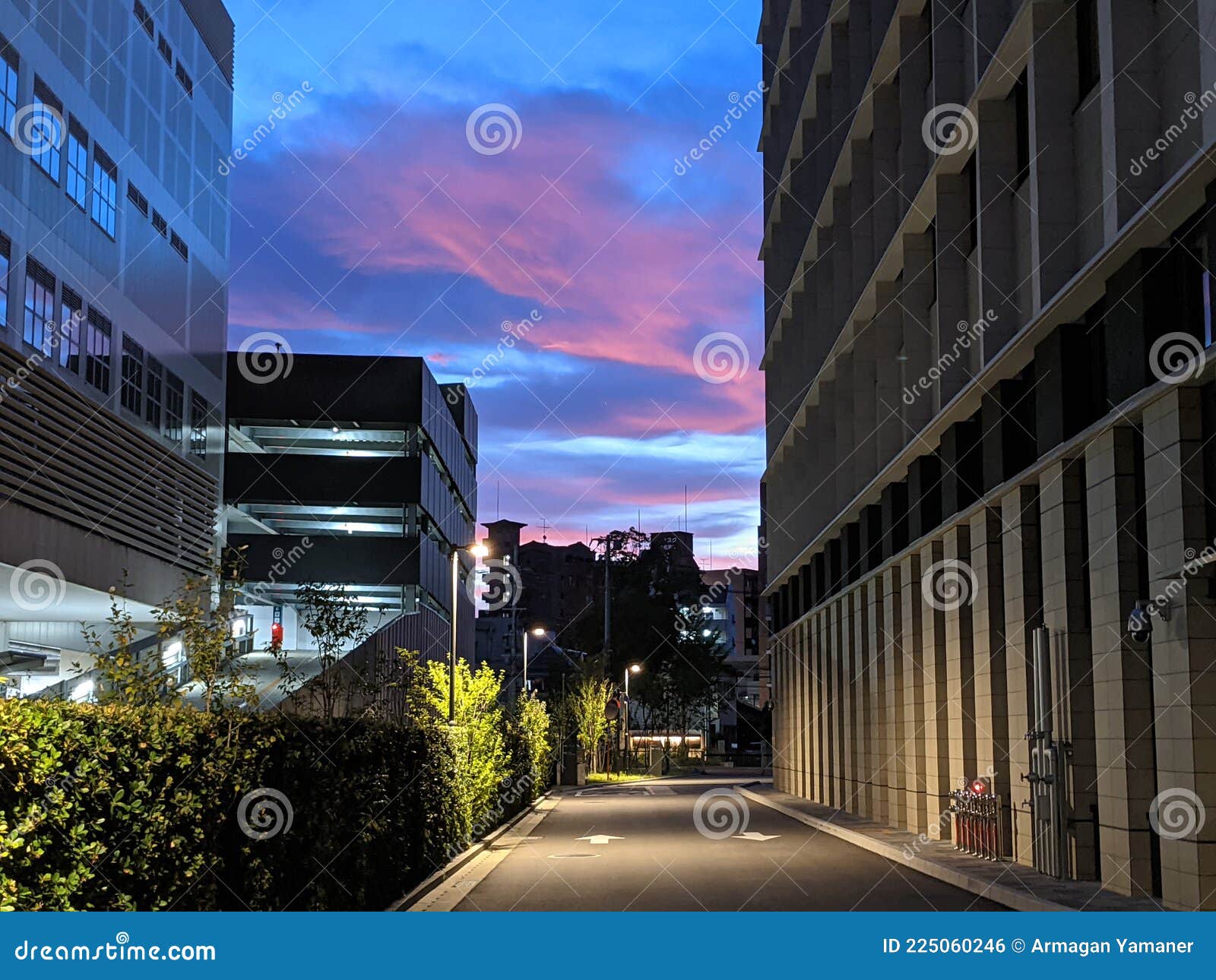 A Walkway between Two Buildings at Dawn with Dramatic Sky Stock Photo ...