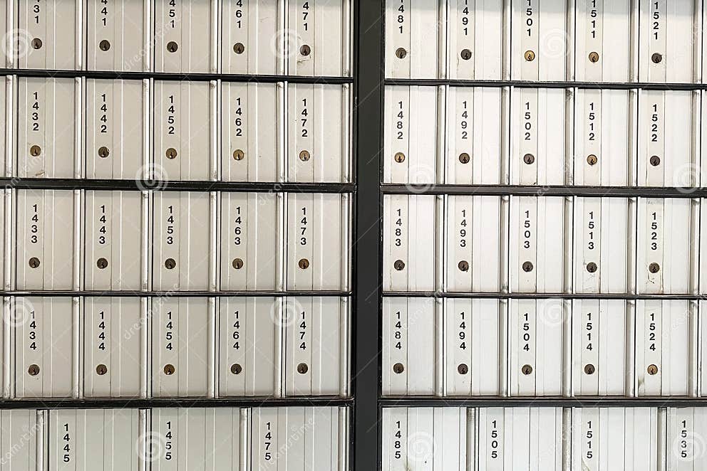 A Wall Adorned with a Row of Post Boxes, Each Awaiting Mail and ...