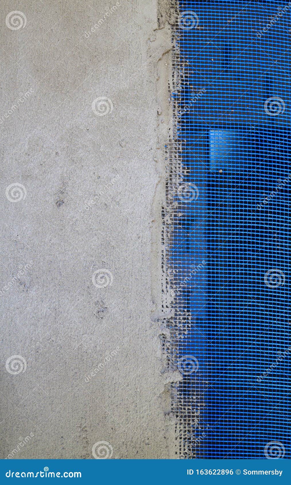 Wall with Applied Plaster and Blue Reinforcing Grid Sticking Out from ...