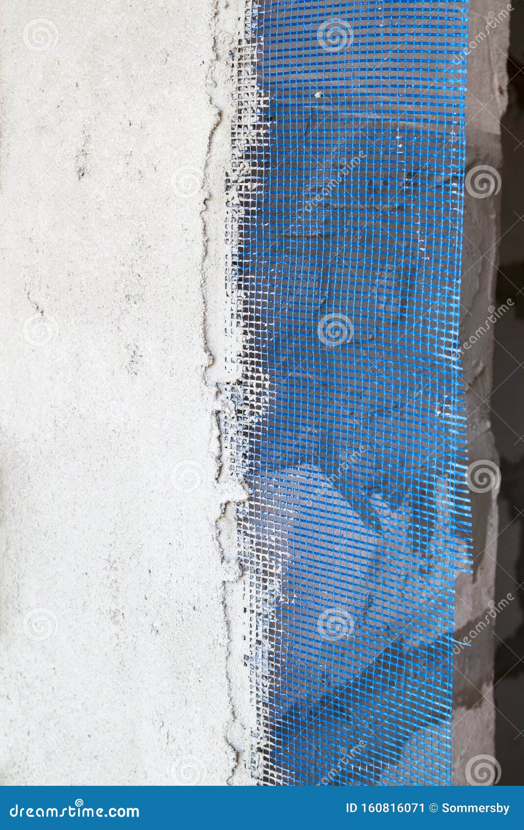 Wall with Applied Plaster and Blue Reinforcing Grid Sticking Out from ...