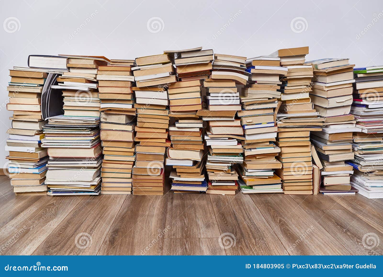 Wall of books piled up stock image. Image of bookshop - 184803905