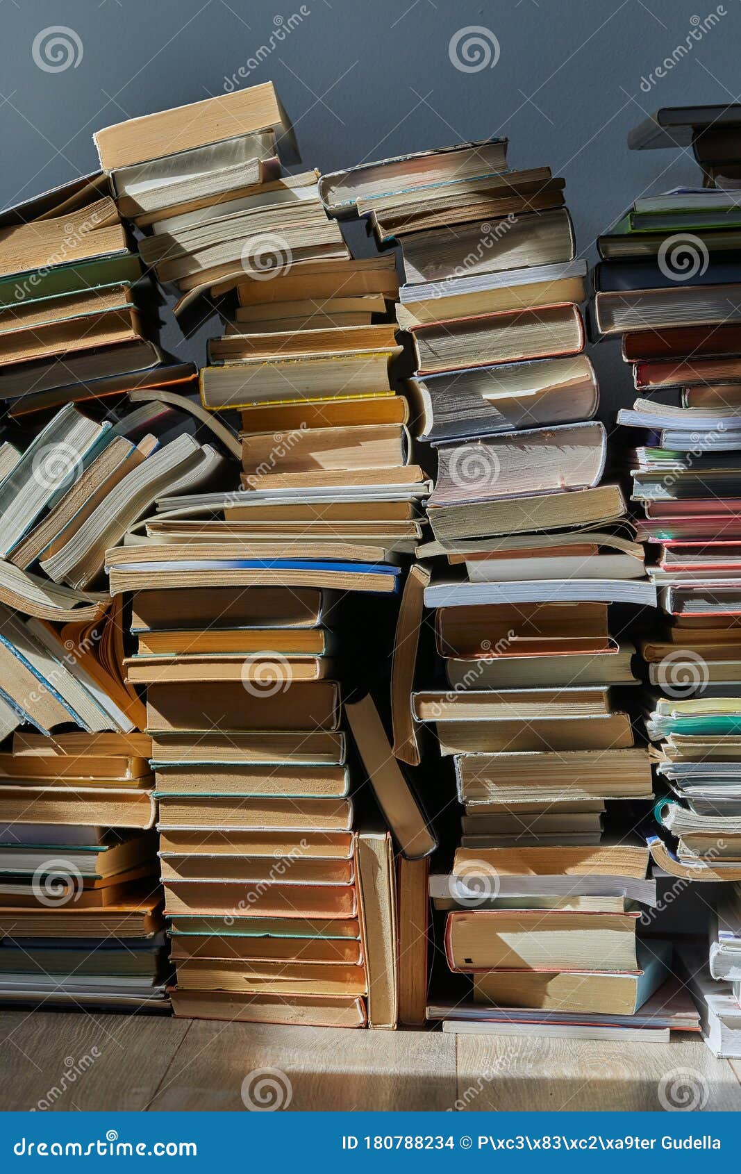 Wall of books piled up stock photo. Image of education - 180788234