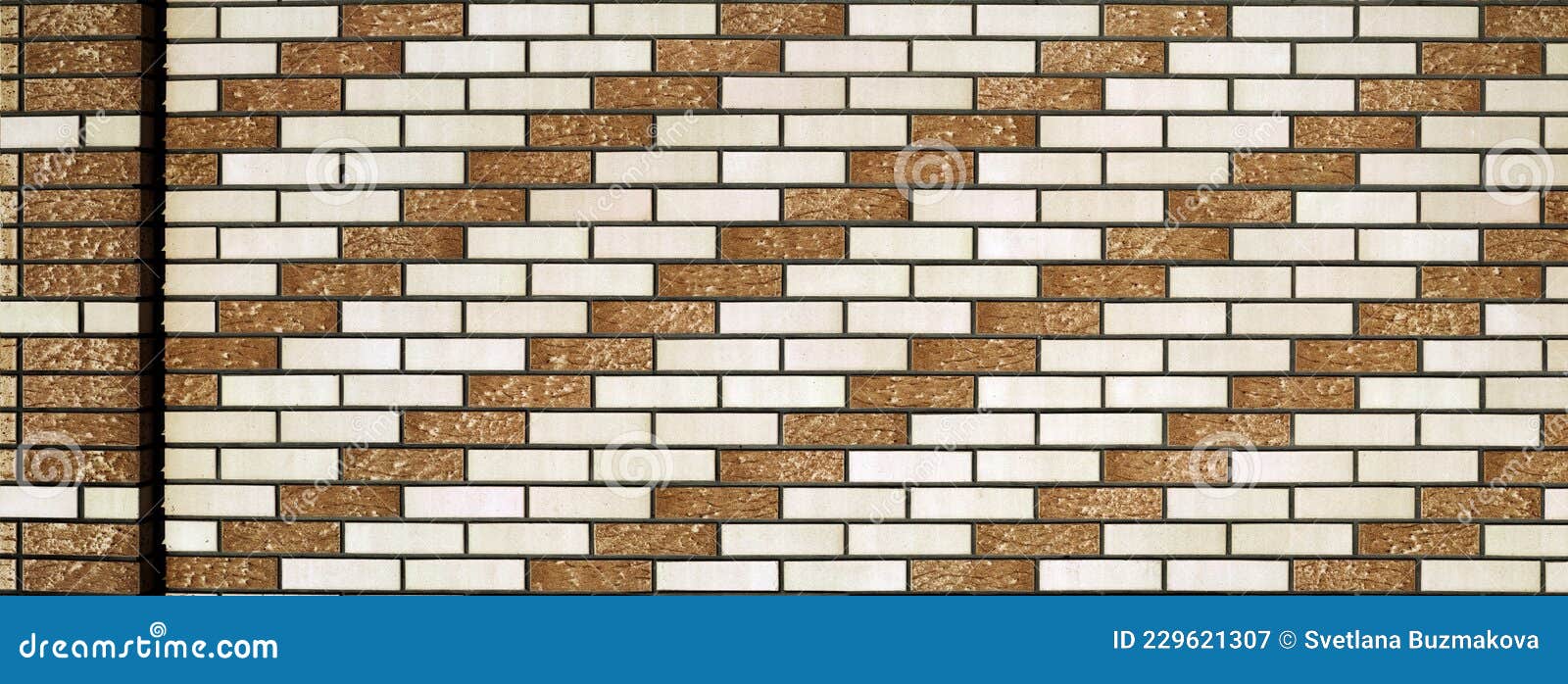 The Wall of the Building is Lined with Facing Bricks or Tiles. Beige ...