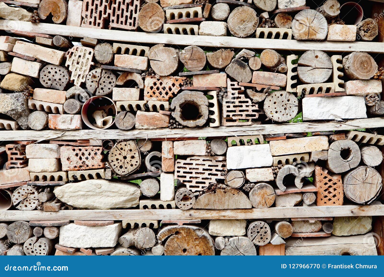 Wall Built of All Kind of Bricks, Stones and Sticks. Stock Photo ...